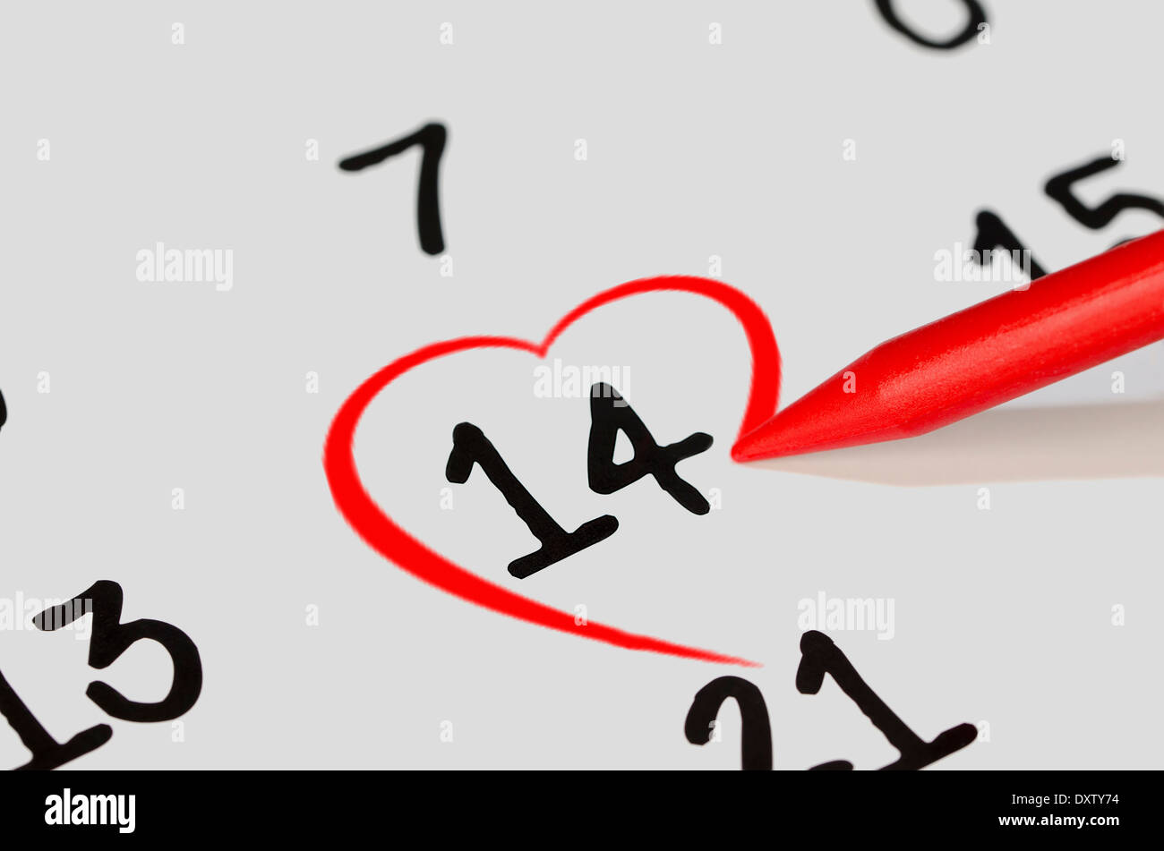 14th of February with a red pencil drawing a heart Stock Photo - Alamy