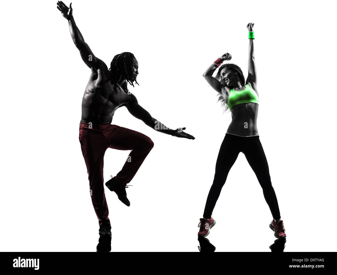 couple man and woman exercising fitness zumba dancing in silhouette on ...