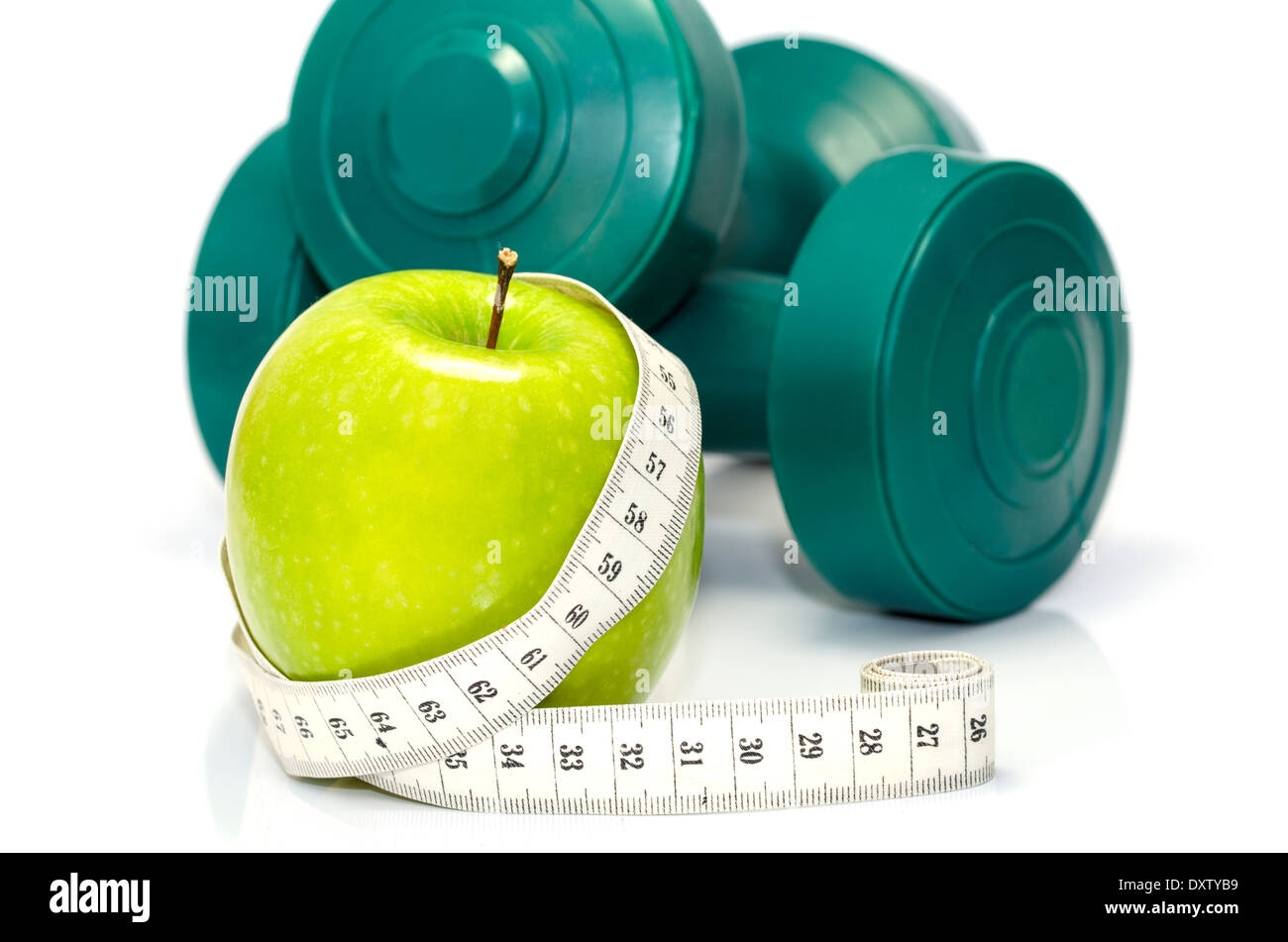 Measuring tape around apple dumbbell hi-res stock photography and ...