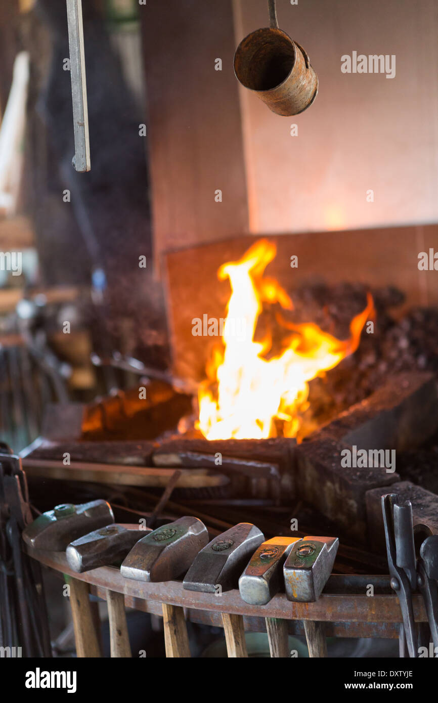 Working forge of the blacksmith in old shop Stock Photo - Alamy