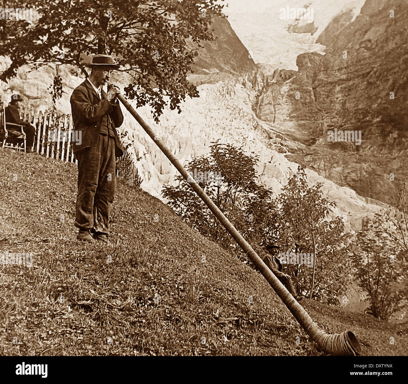 Alpine horn Grindelwald Switzerland early 1900s Stock Photo - Alamy