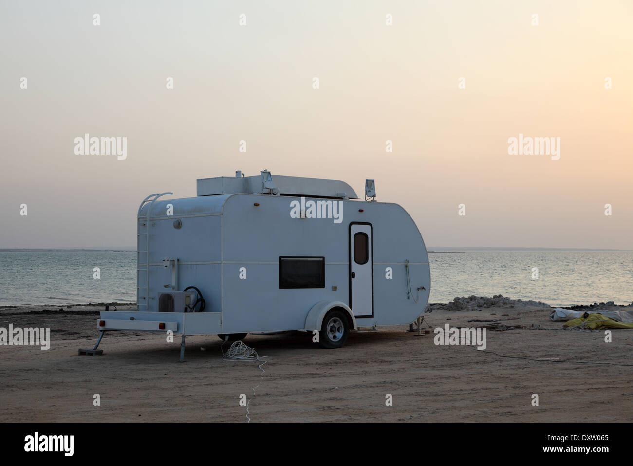 Trailer on the beach of Arabian Gulf in Qatar Stock Photo - Alamy