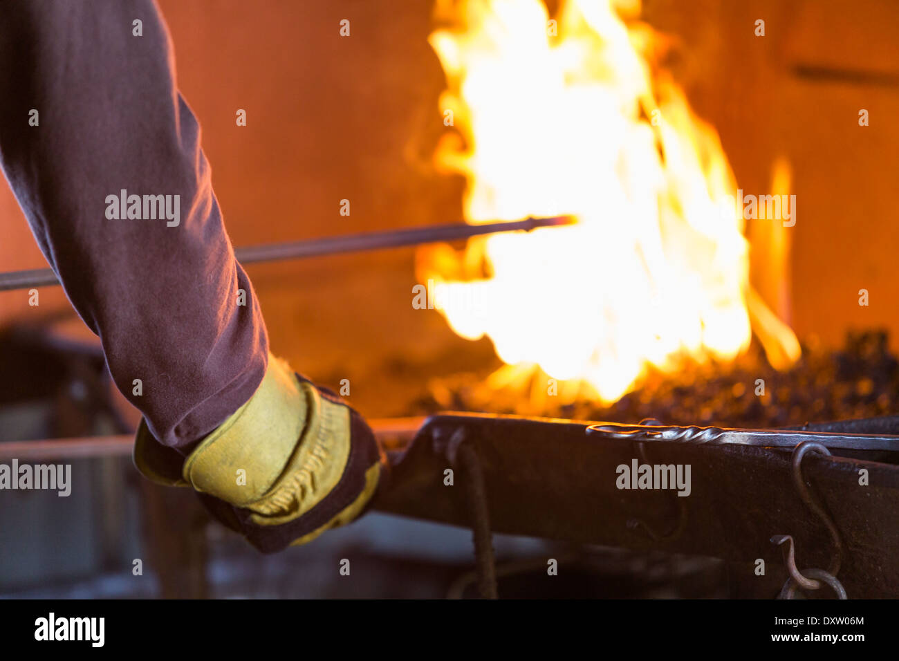 A blacksmith working at an old iron forge Stock Photo - Alamy