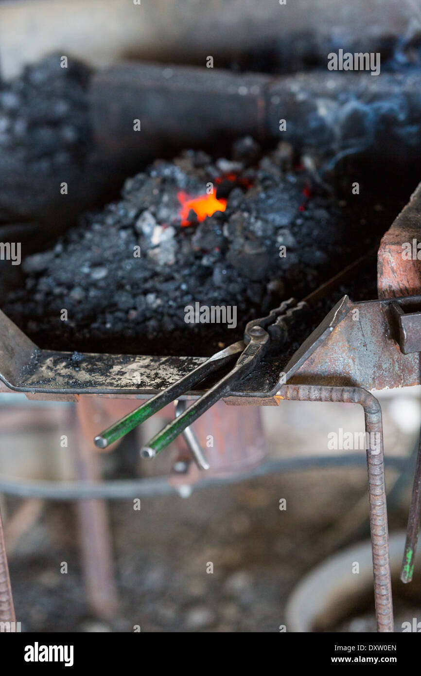 Working forge of the blacksmith in old shop Stock Photo - Alamy