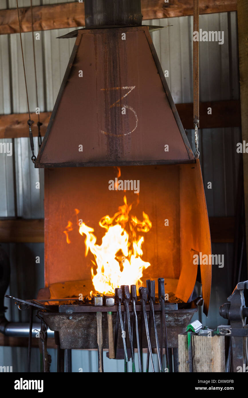 Working forge of the blacksmith in old shop Stock Photo - Alamy