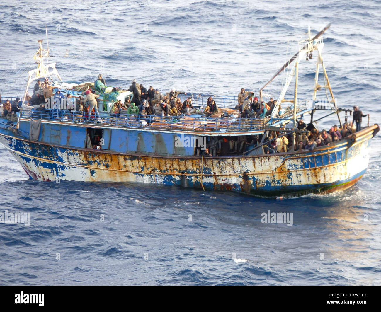 Crete Island, Greece. 31st Mar, 2014. Immigrants crowd on the deck of a ...