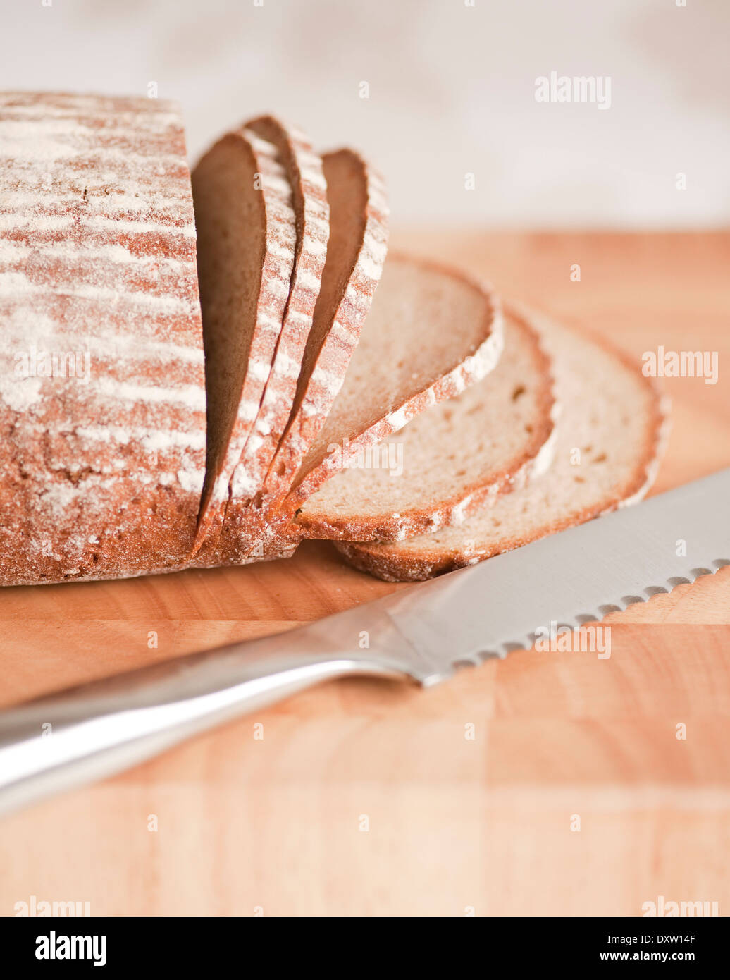 Slicing a loaf of bread Stock Photo - Alamy