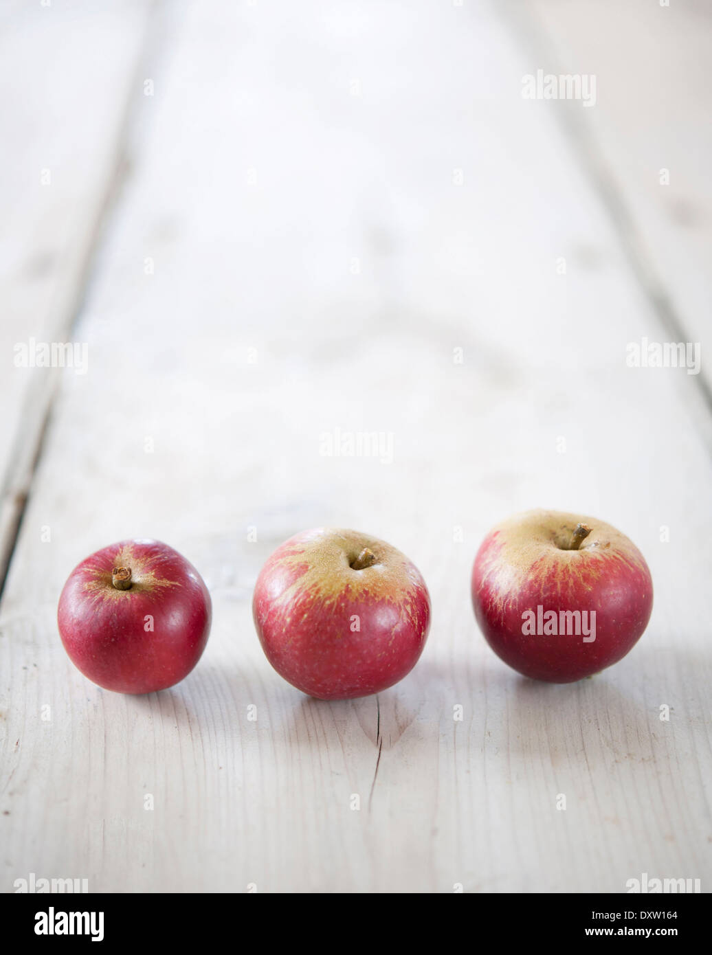 Three mini red apples Stock Photo - Alamy