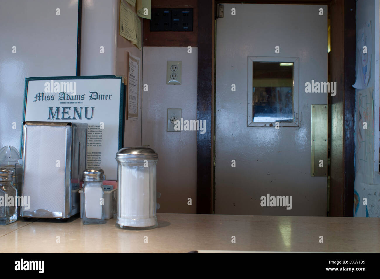 Diner menu sits on the counter in a small town diner. Door to kitchen ...