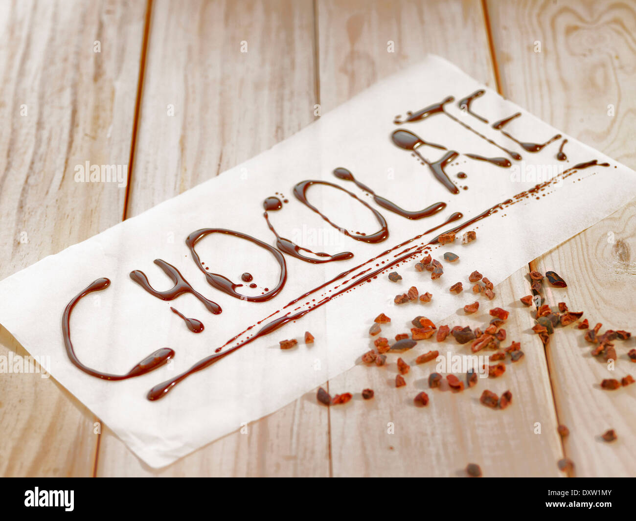 Chocolate written with melted chocolate Stock Photo - Alamy