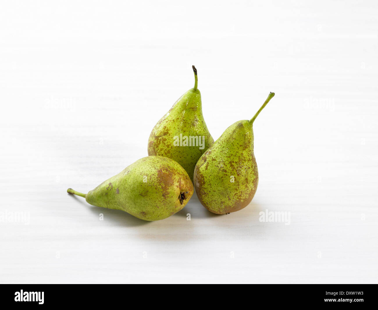 Conference pears on a white background Stock Photo - Alamy