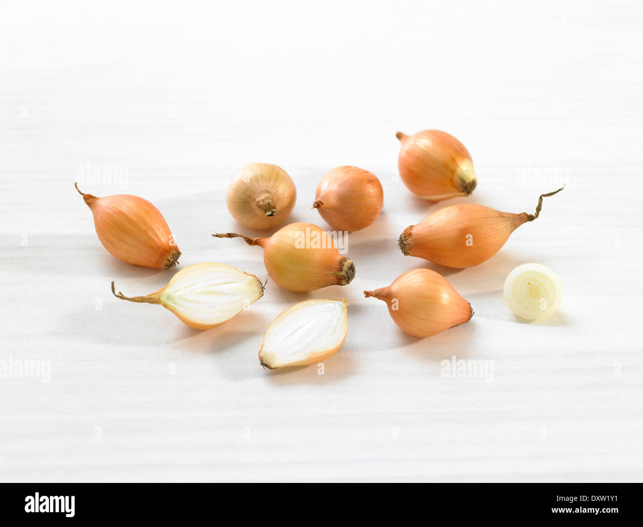 Echalots on a white background Stock Photo - Alamy