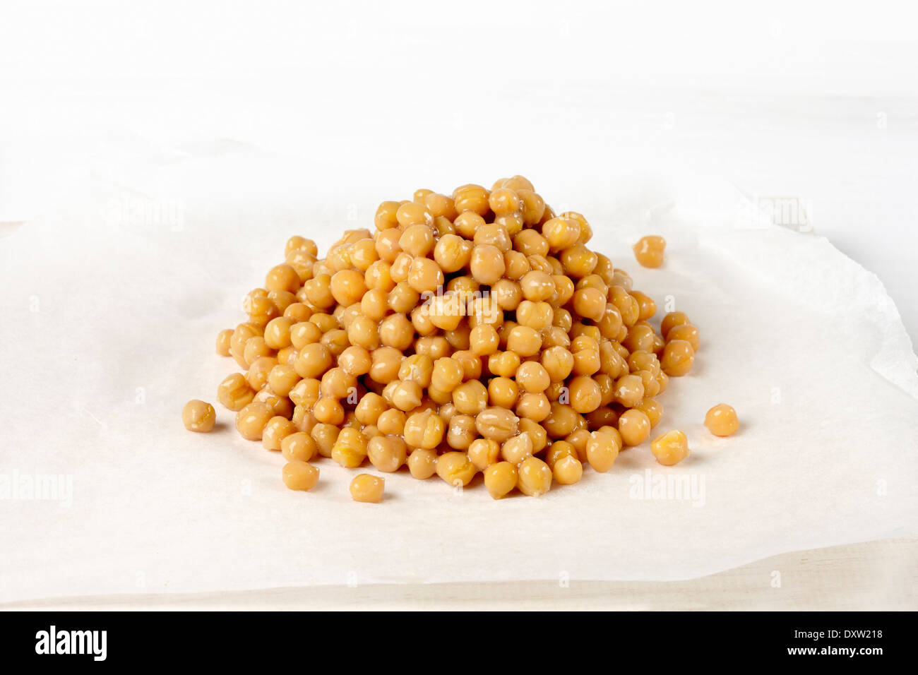Cooked chickpeas on a white background Stock Photo - Alamy