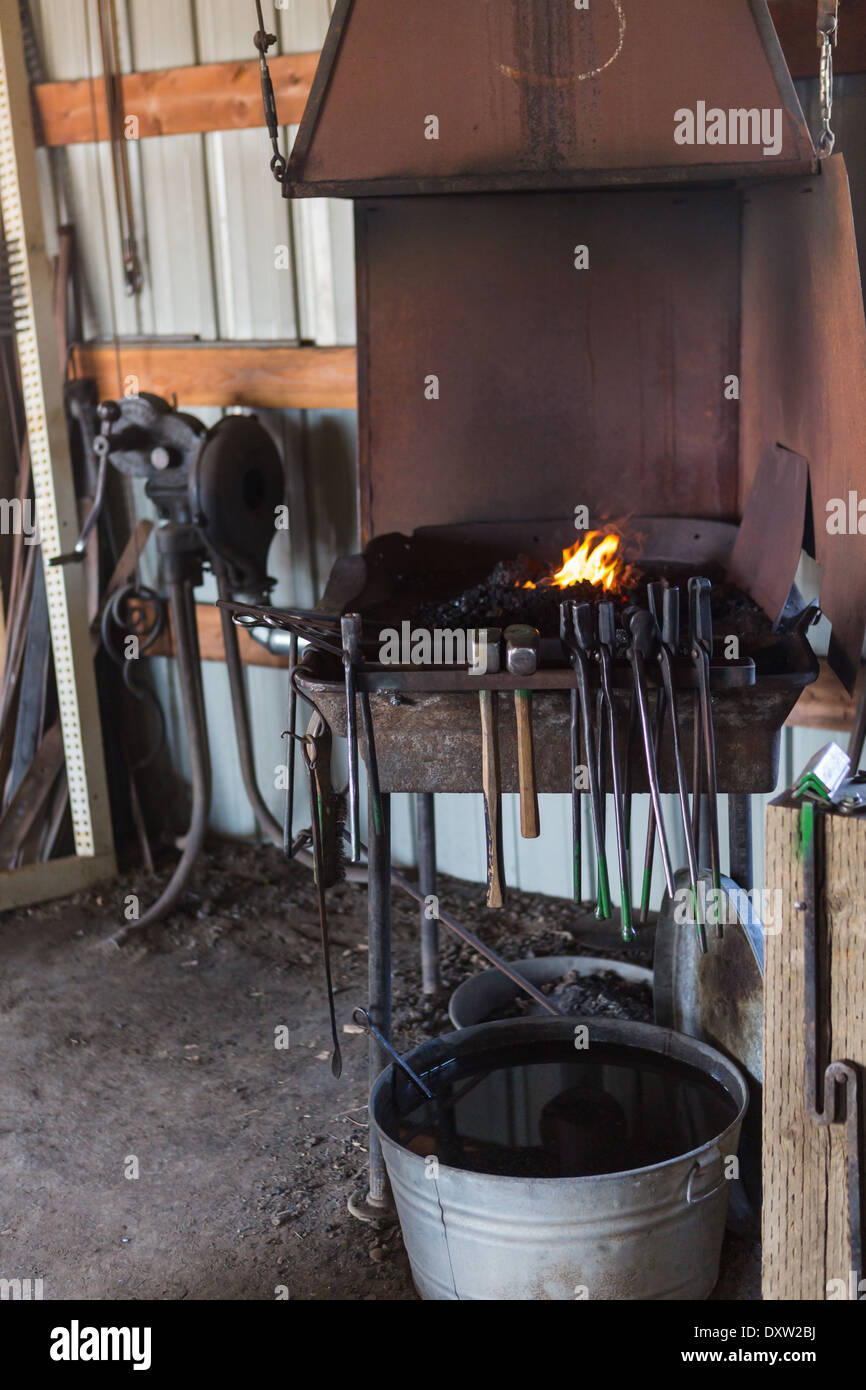 Working forge of the blacksmith in old shop Stock Photo - Alamy