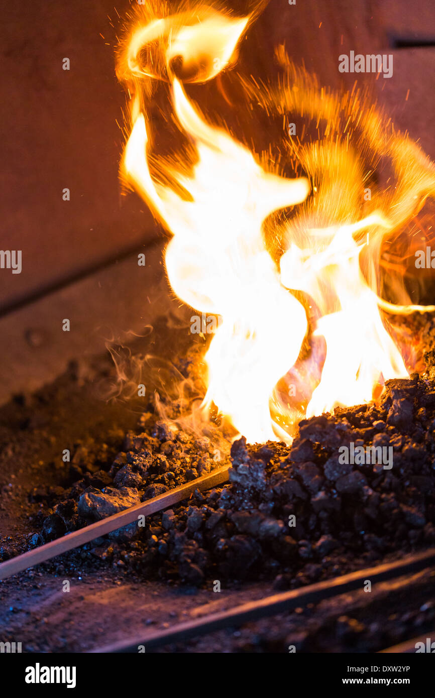 Working forge of the blacksmith in old shop Stock Photo - Alamy