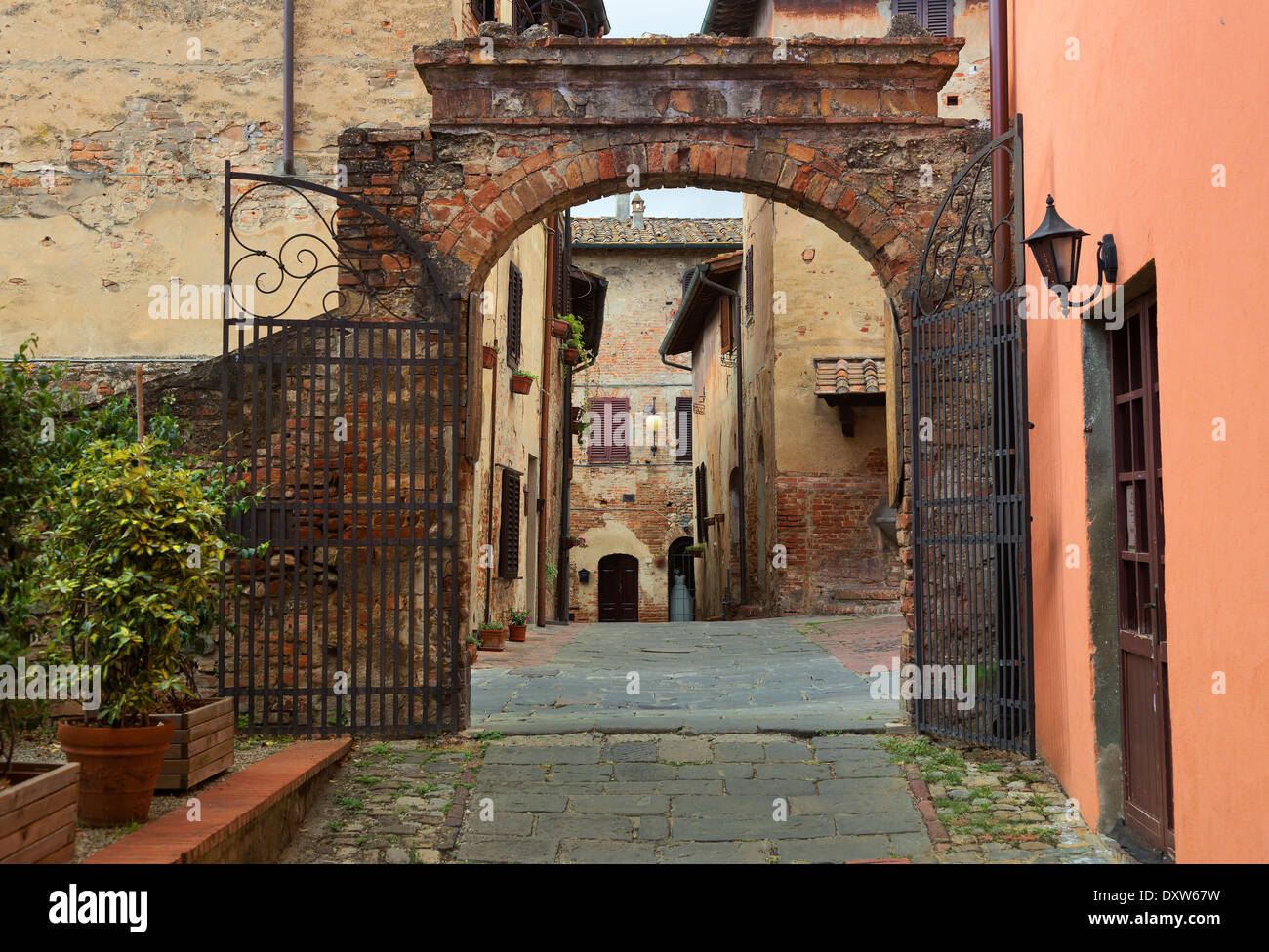Arch to street in Tuscany medieval town of Certaldo Alto, Italy Stock ...