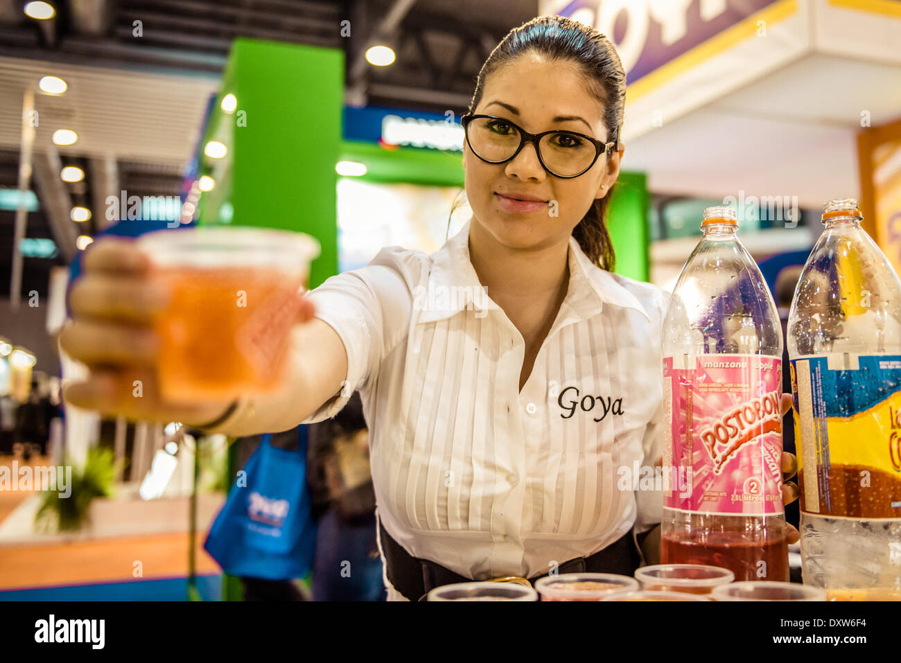 Barcelona, Spain. March 31st, 2014: A hostess hands out some Columbian ...