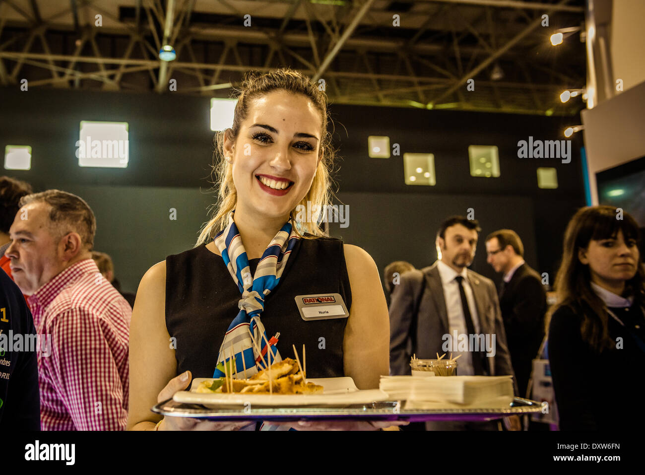 Barcelona, Spain. March 31st, 2014: A hostess at the "Rational Cooking ...