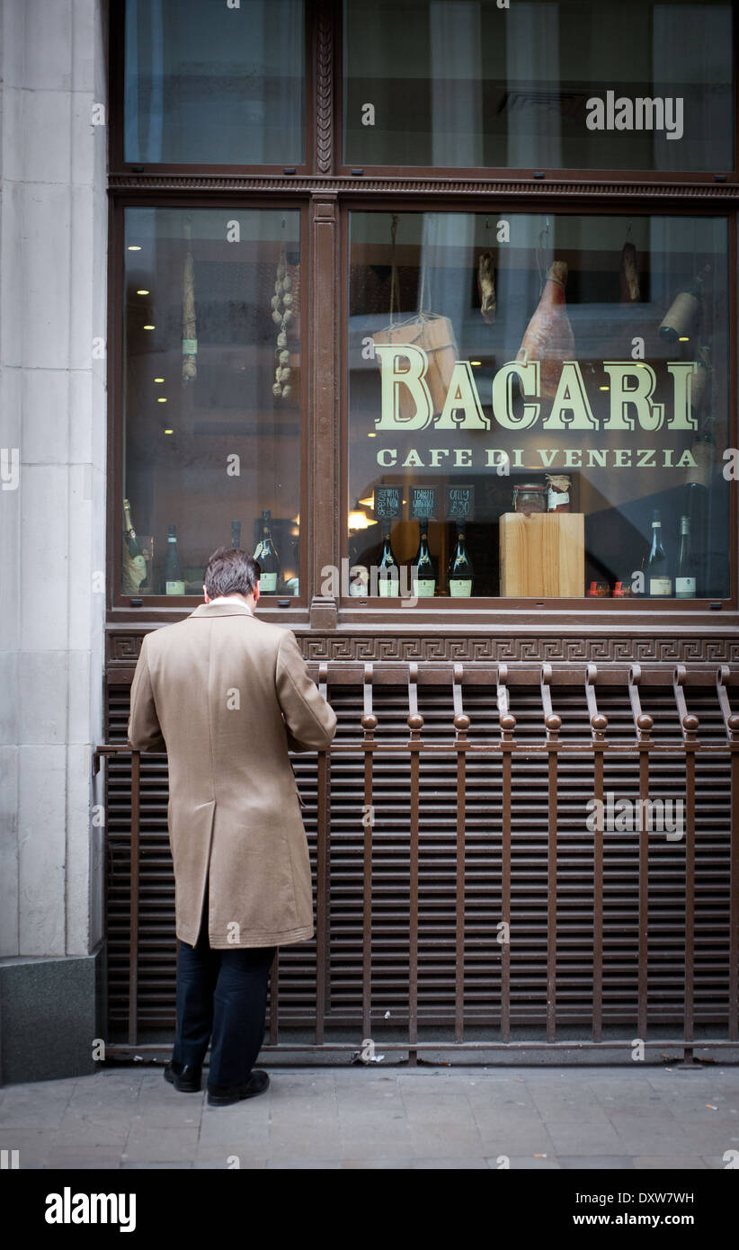 Businessman outside Italian cafe Stock Photo - Alamy