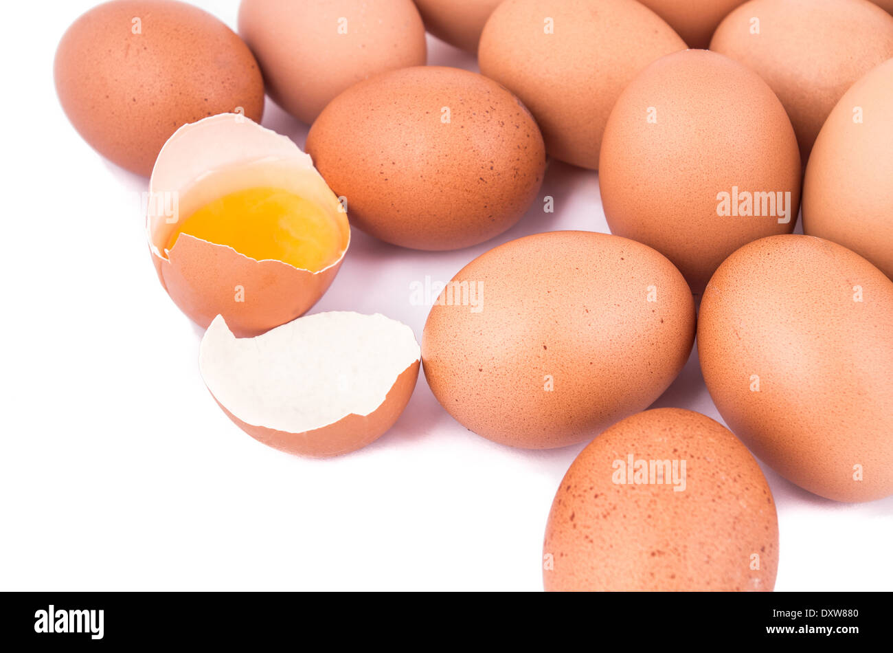 eggs on a white background with an open egg Stock Photo - Alamy