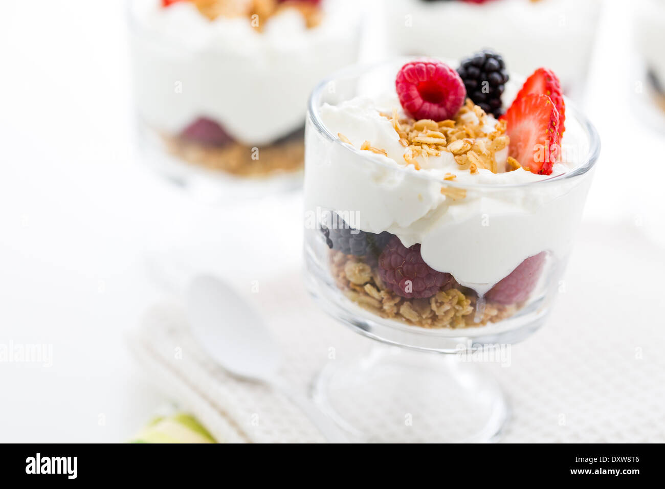 Breakfast parfait made from Greek yogurt and granola topped with fresh ...