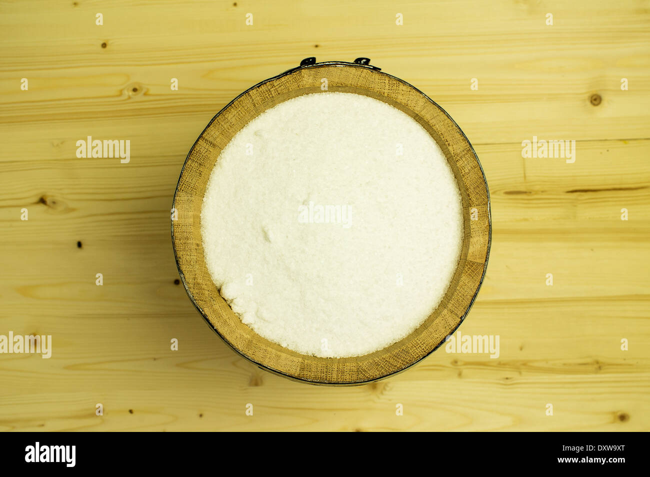 Dietary salt in the wooden tub closeup Stock Photo - Alamy
