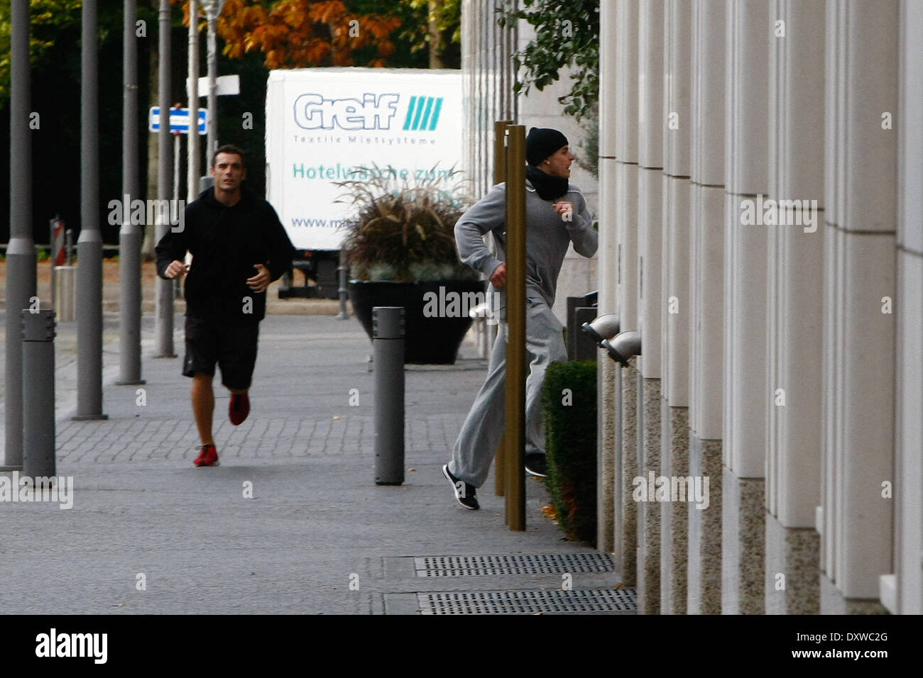Casper Smart running passed the photographers outside Ritz Carlton ...