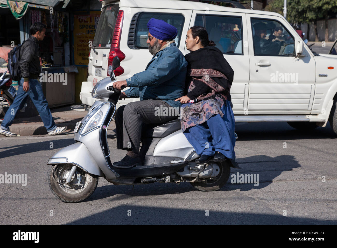 India, Dehradun. A Sikh Man and Woman Riding a Motorbike--Wearing a ...