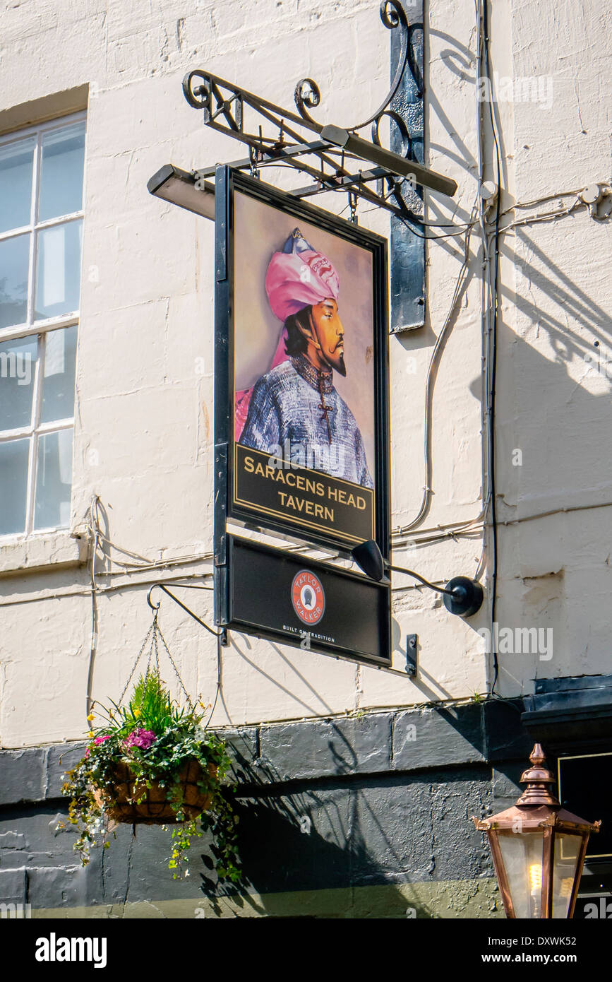 View of a traditional English pub sign hanging over the Saracens Head ...