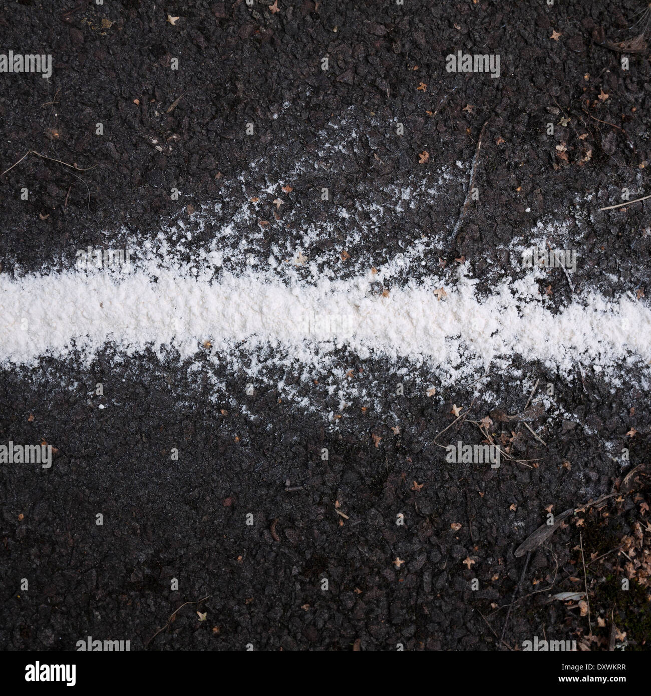 Line of white powder on pavement Stock Photo - Alamy