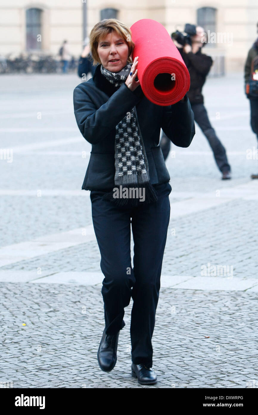 Bettina Boettinger carrying a red carpet (or is it an oversized yoga ...