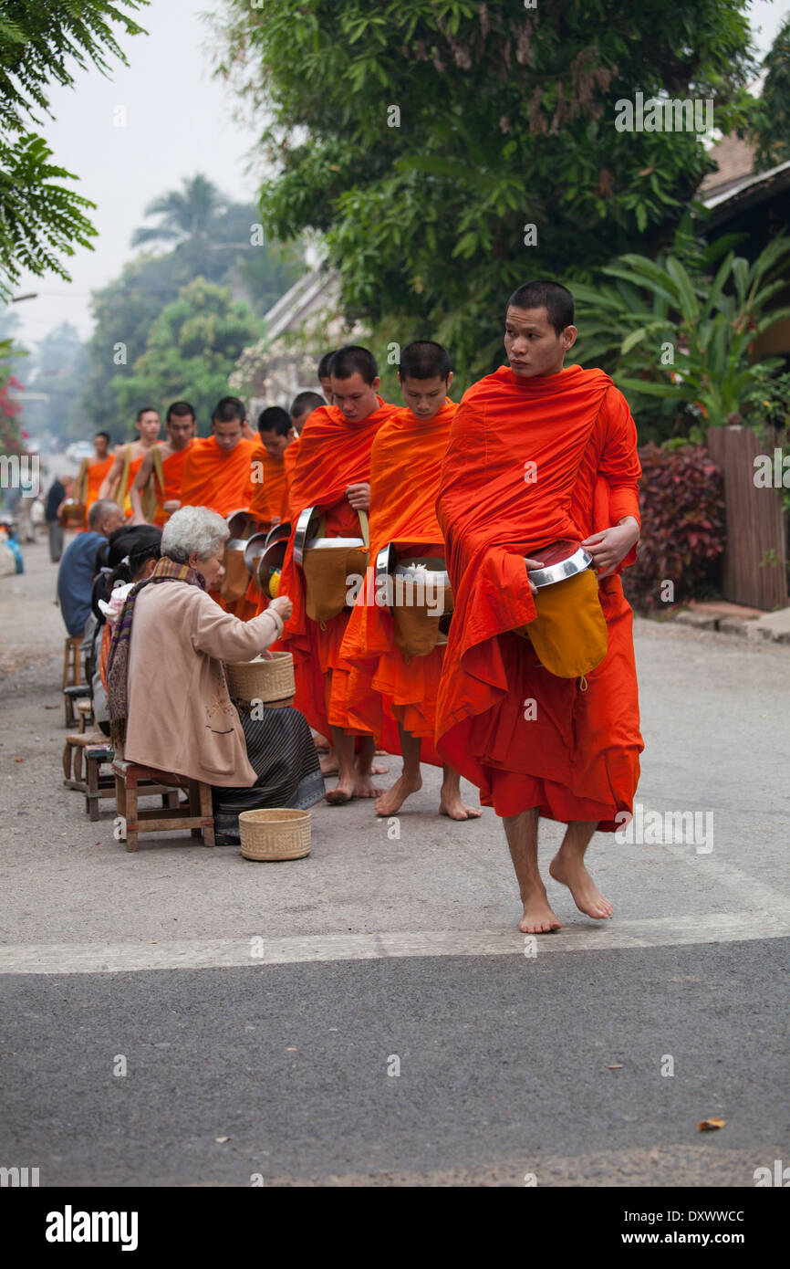 Buddhist ritual offering rice hi-res stock photography and images - Alamy