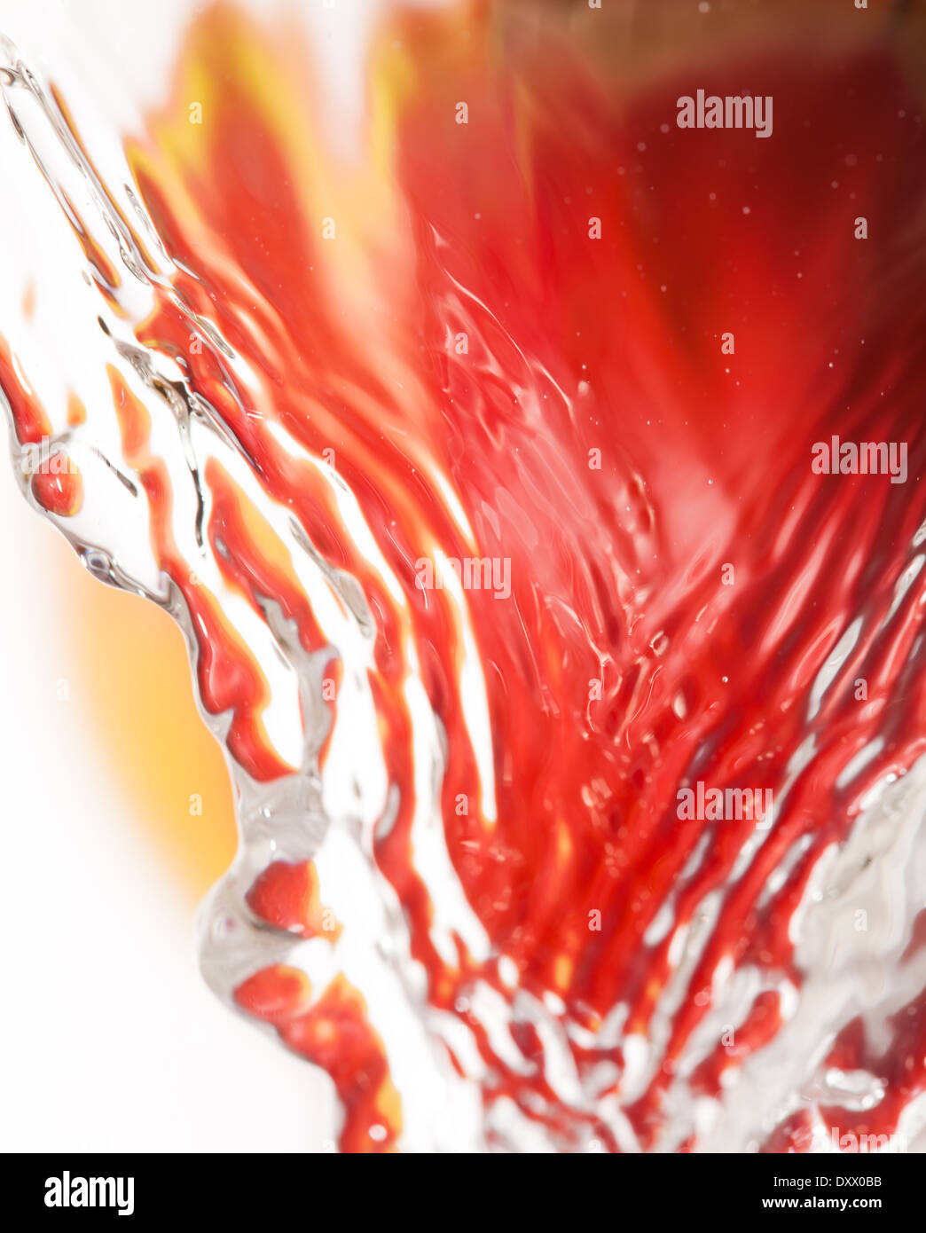 washing apple - red apple being washed under a jet of water, frozen ...