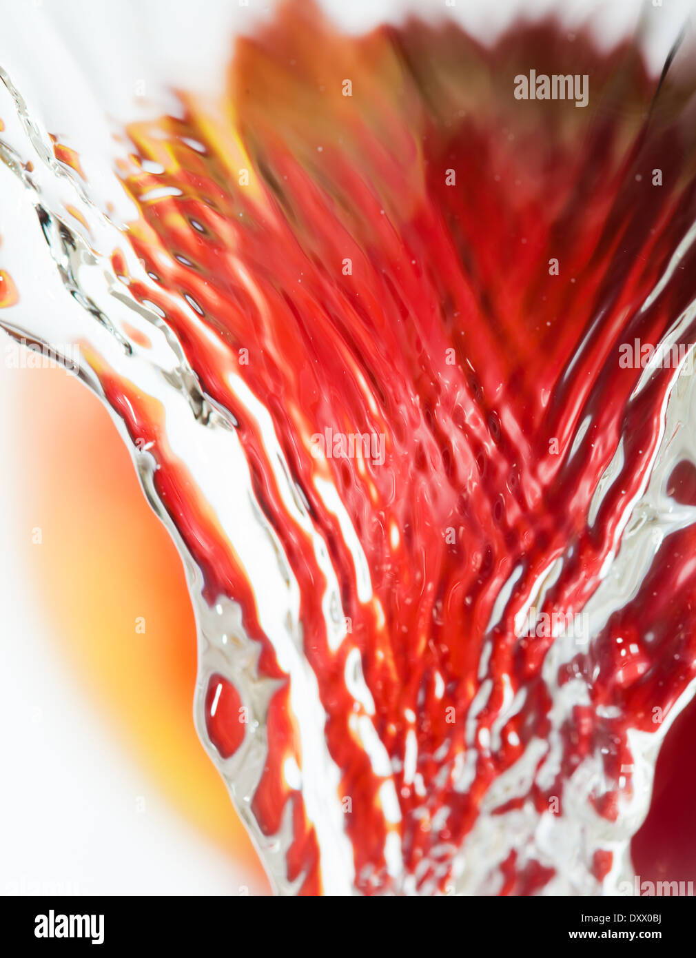 washing apple - red apple being washed under a jet of water, frozen ...
