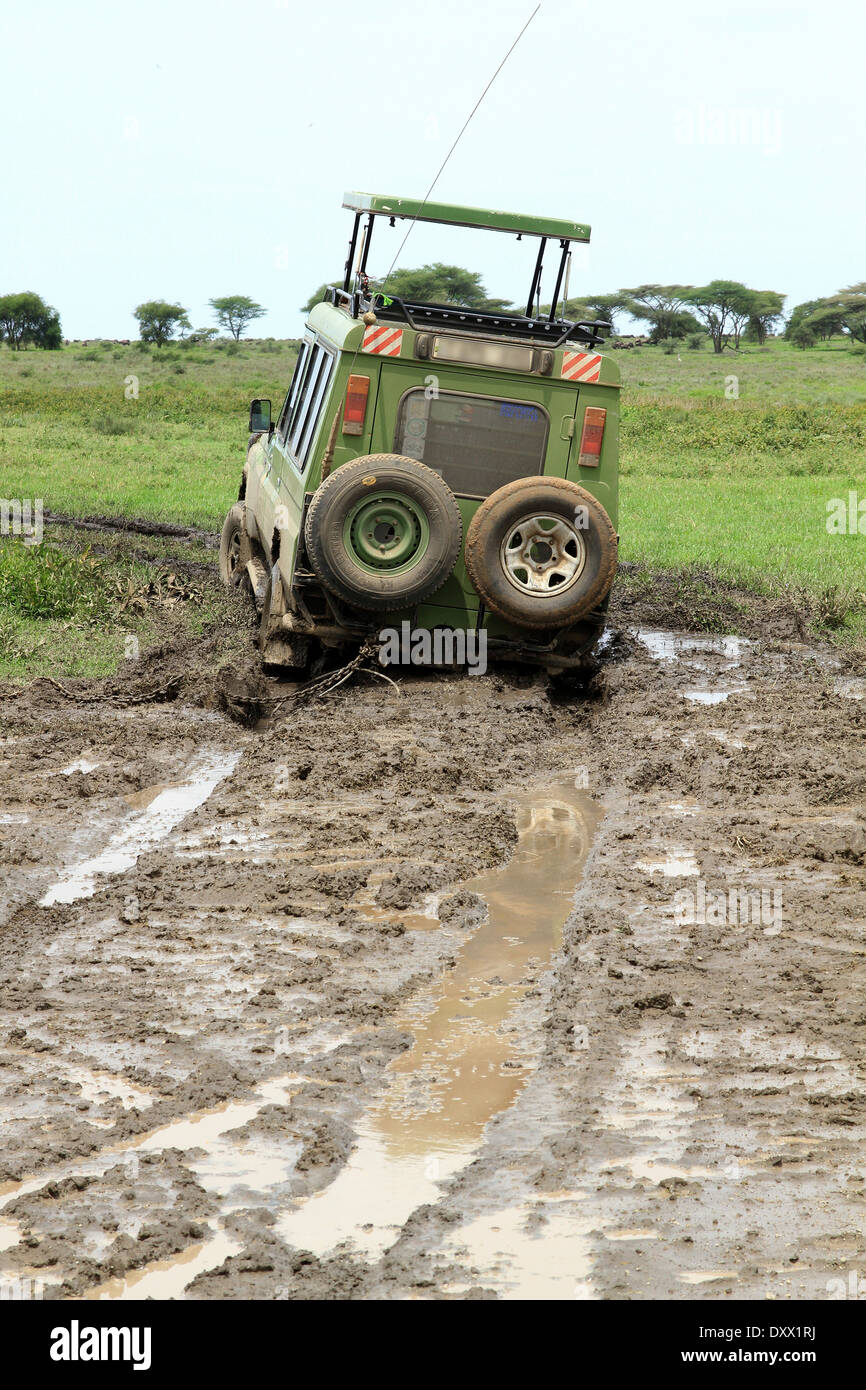 Safari vehicle, mud road, Serengeti, Tanzania Stock Photo - Alamy