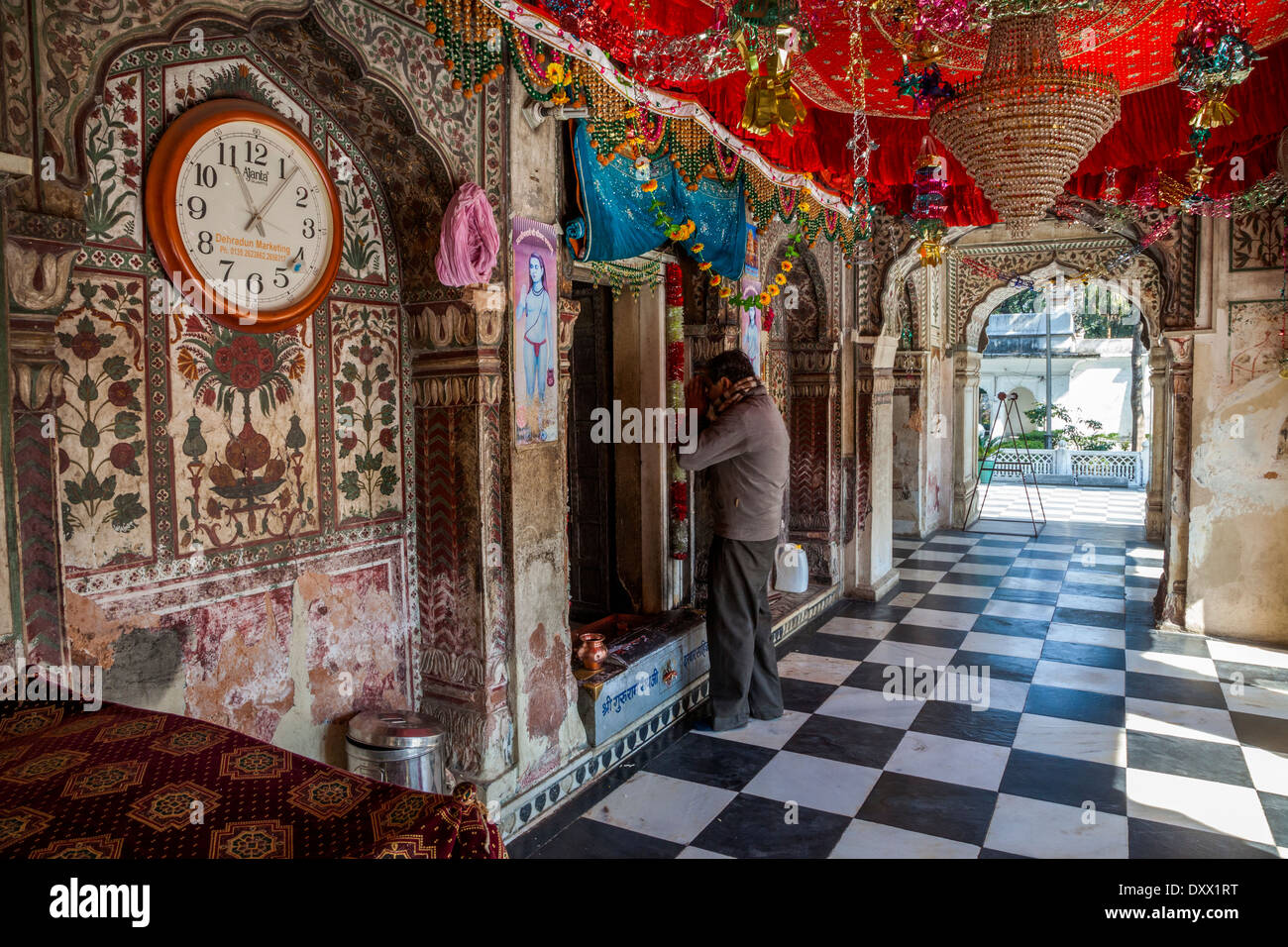 India, Dehradun. Man Praying at Entrance to Inner Shrine of the Sikh ...