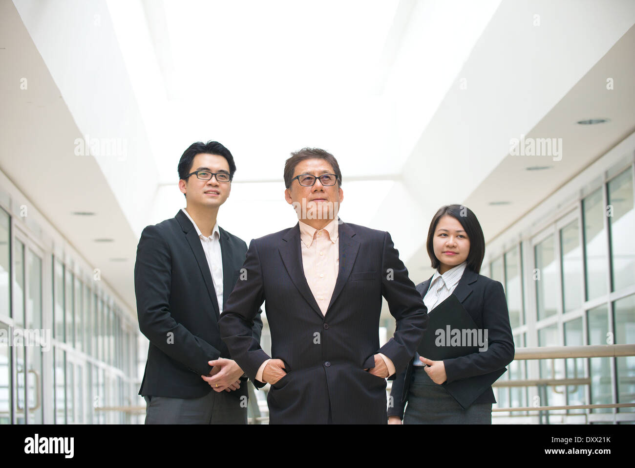 asian business team in office background Stock Photo - Alamy