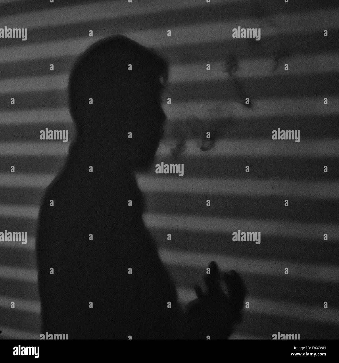 Shadow of man smoking Stock Photo - Alamy