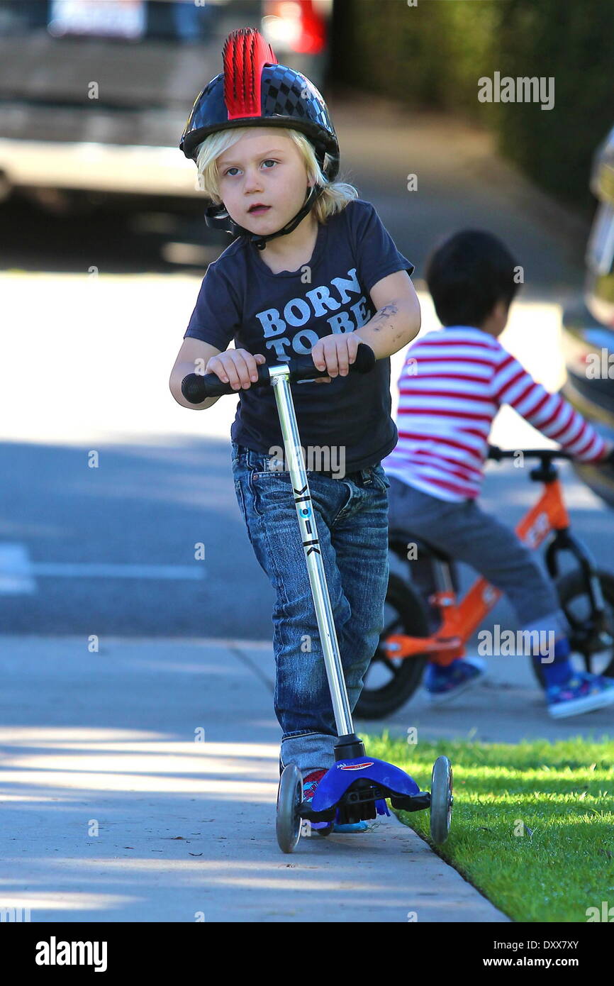 Zuma Rossdale wearing a 'mohawk' helmet while riding his scooter at a ...