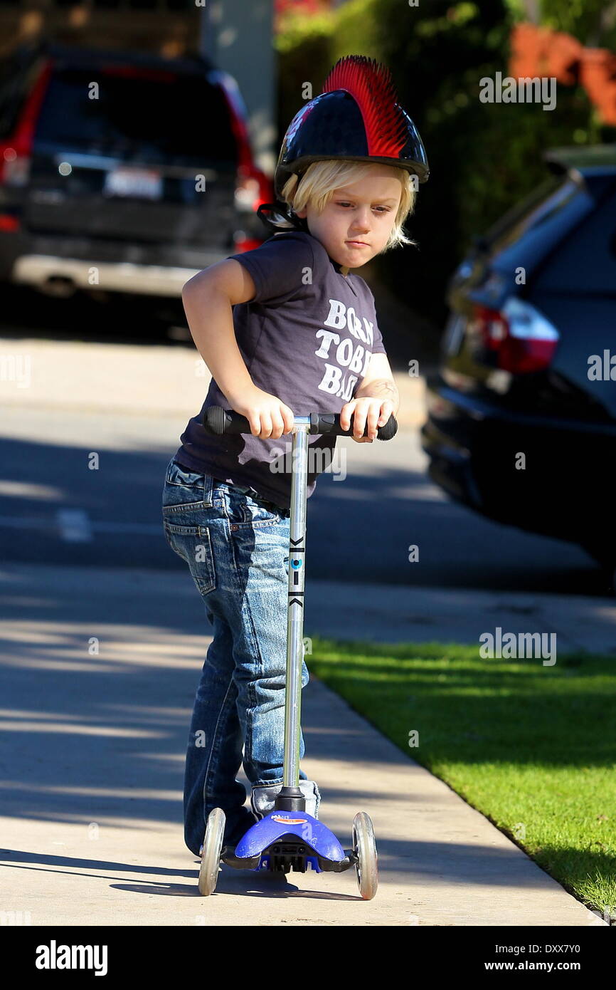 Zuma Rossdale wearing a 'mohawk' helmet while riding his scooter at a ...