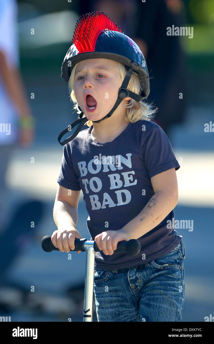 Zuma Rossdale wearing a 'mohawk' helmet while riding his scooter at a ...