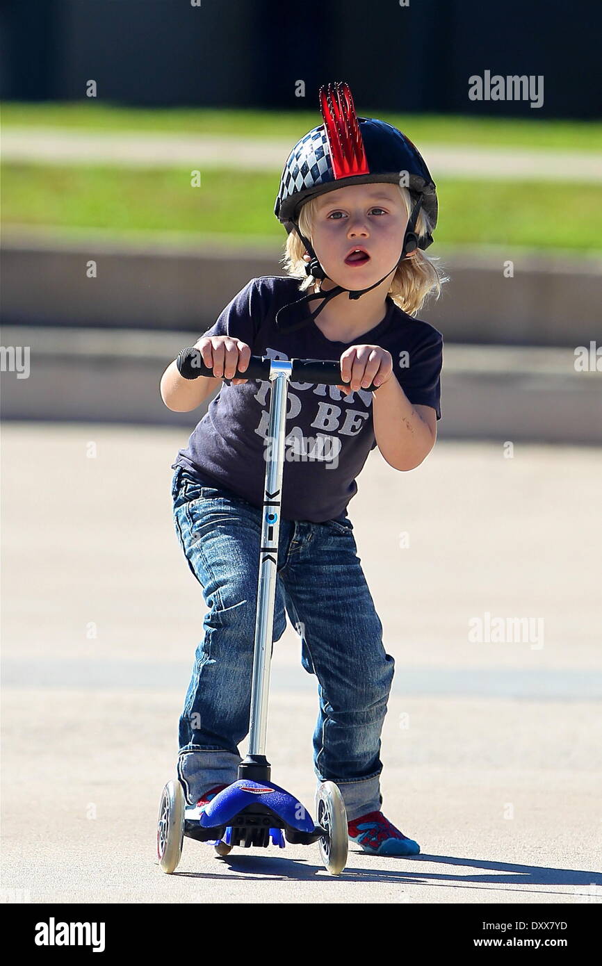 Zuma Rossdale wearing a 'mohawk' helmet while riding his scooter at a ...