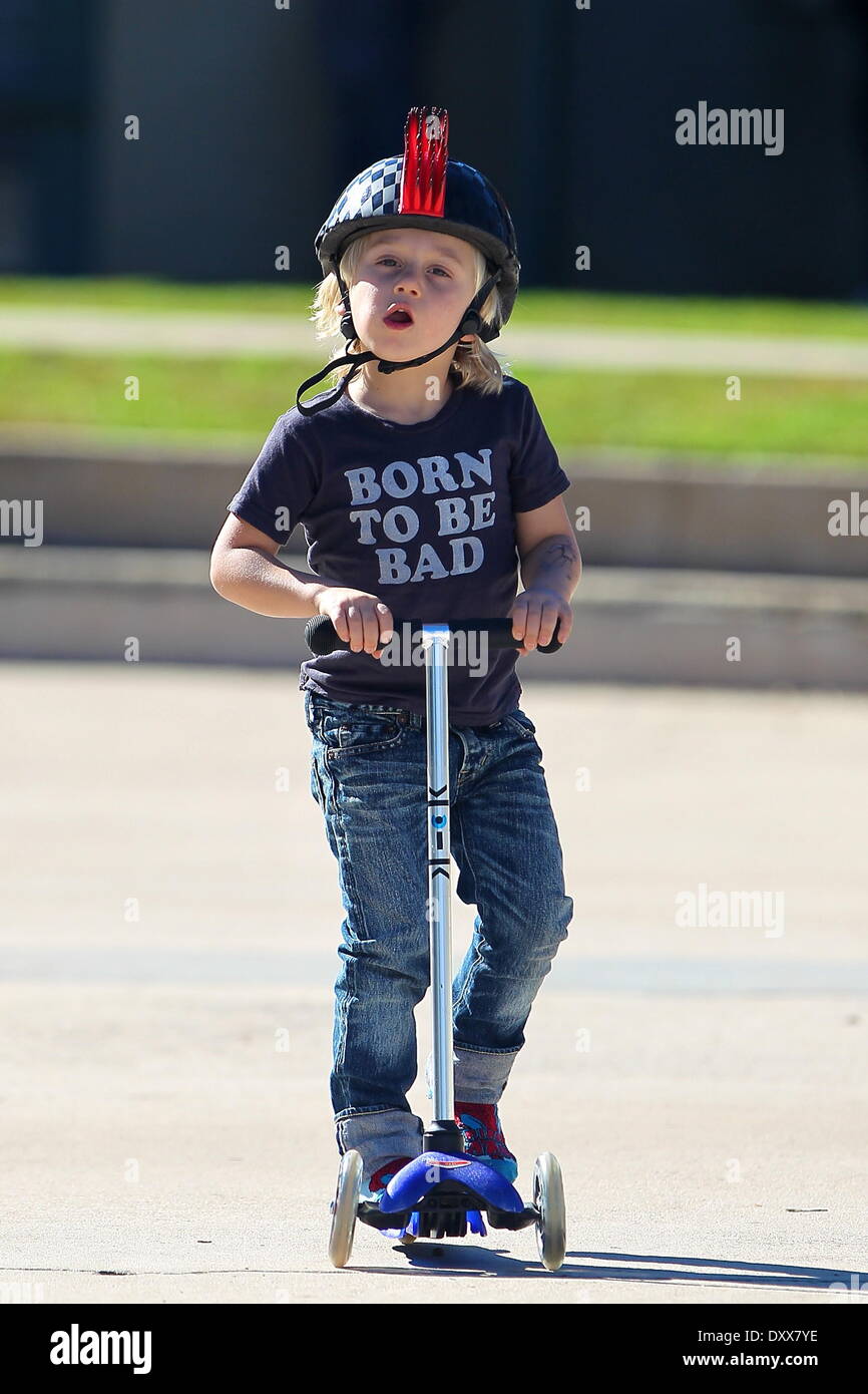 Zuma Rossdale wearing a 'mohawk' helmet while riding his scooter at a ...