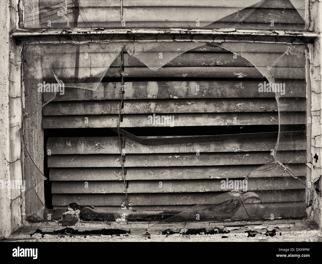 Broken window in neglected commercial building, UK Stock Photo - Alamy
