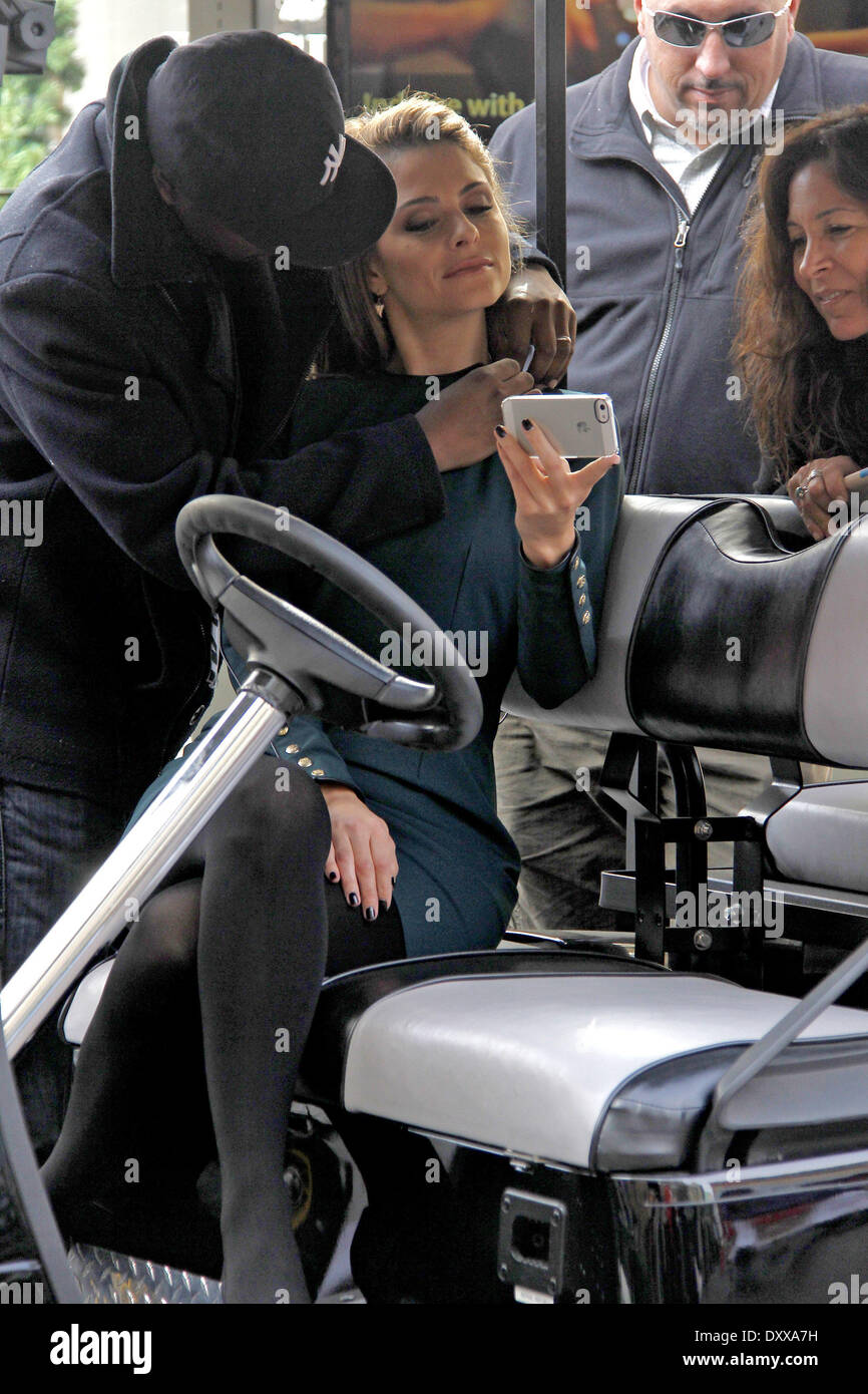 Extra' host Maria Menounos enjoys a video on her iPhone with a friend ...