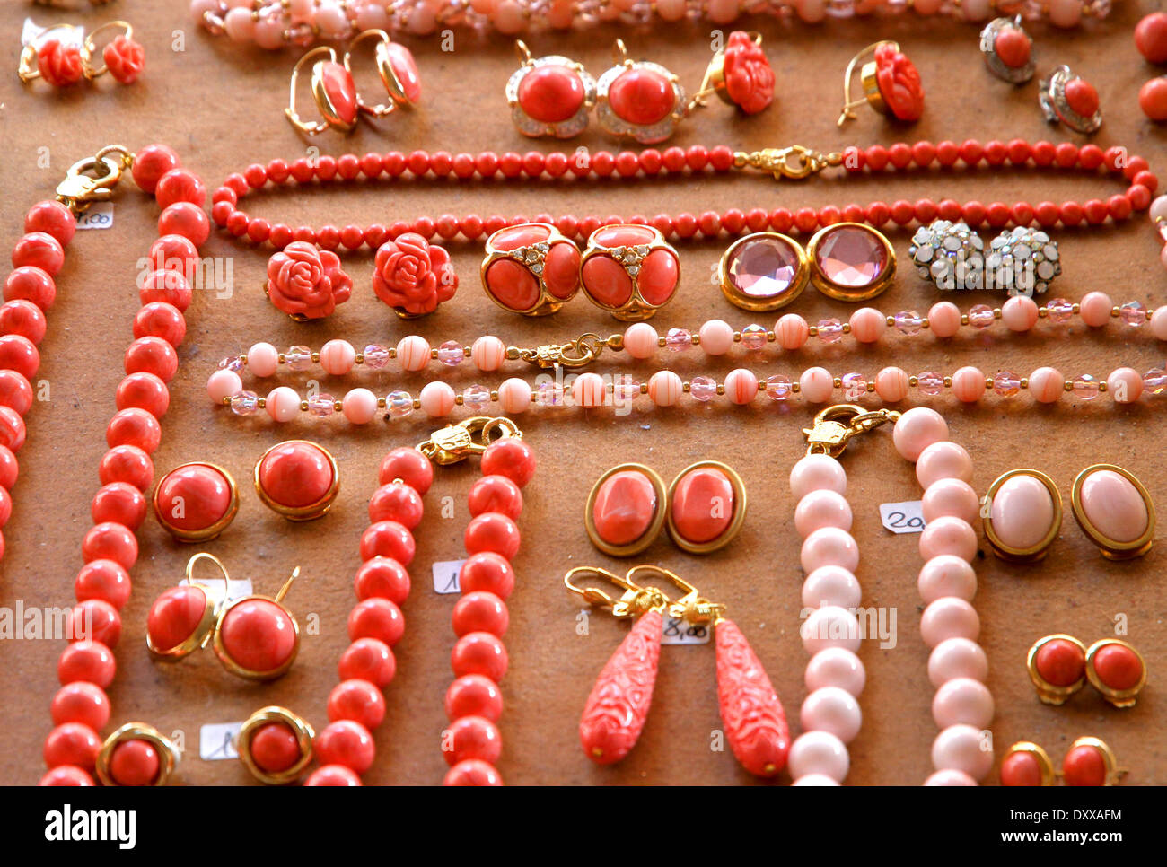 necklaces, earrings, and precious gems in a stand in the Italian city ...