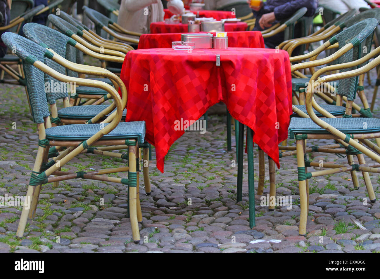 Red tablecloth over the tables of a cafe to open in a famous European ...