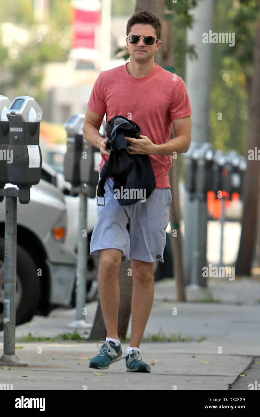 Topher Grace holding his jeans in his hands as he heads to his gym Los ...
