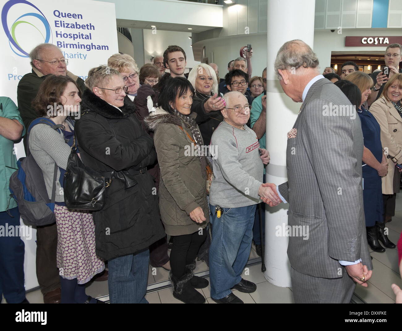 Charles, Prince of Wales meets members of the public and staff during a ...