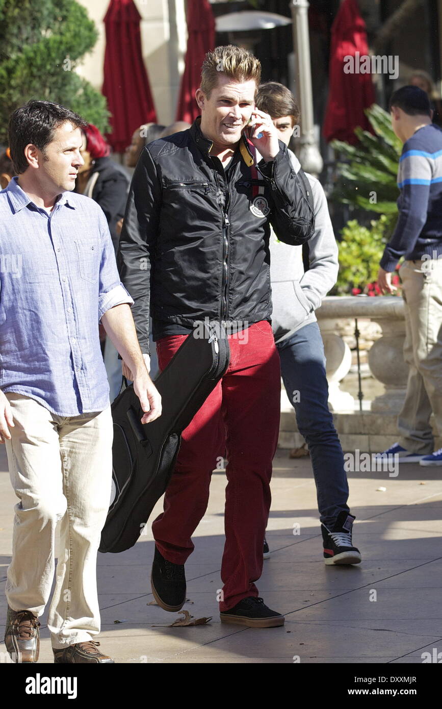 Sugar Ray's lead singer Mark McGrath seen carrying a guitar case and on ...